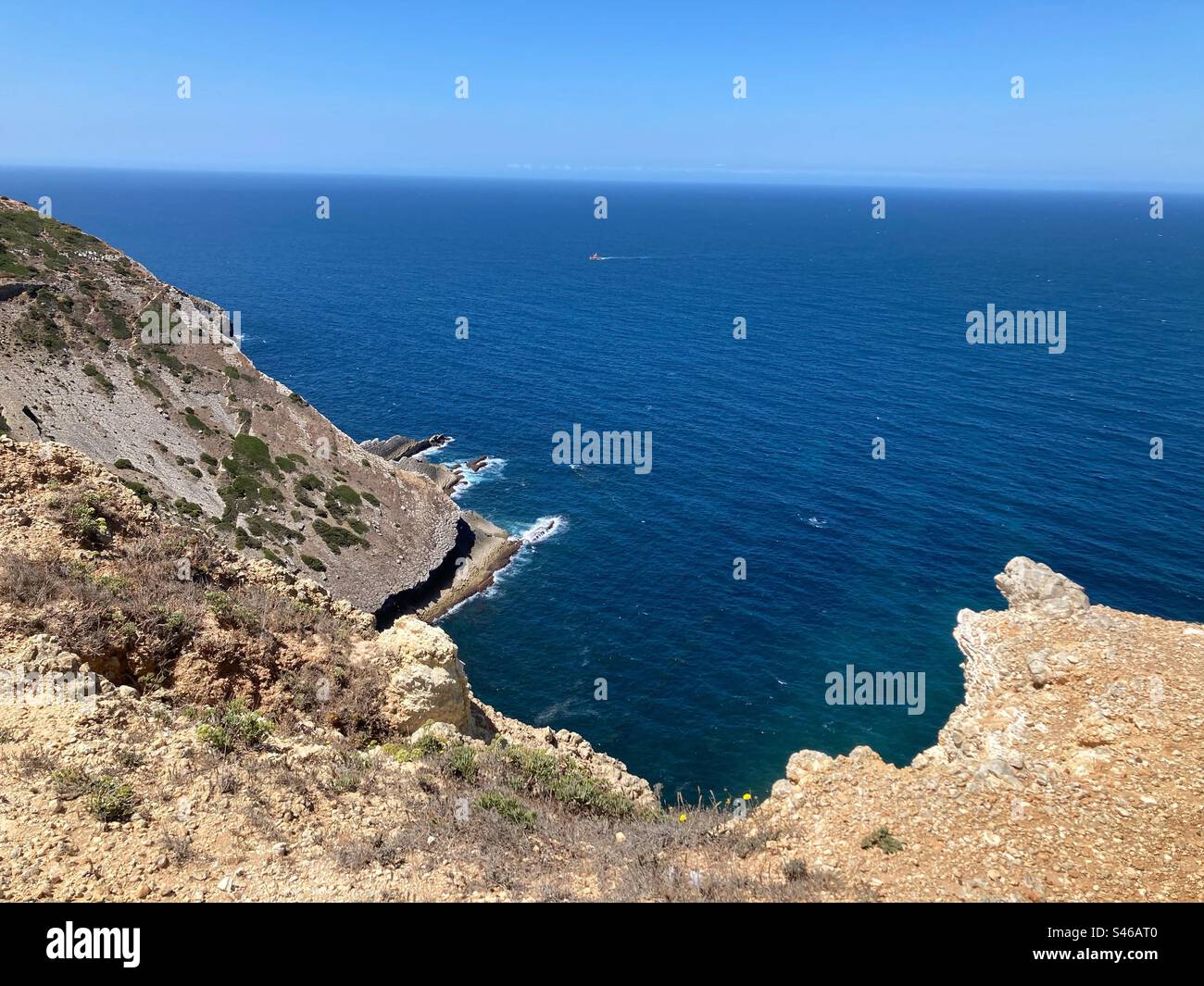 Cliff and sea side landscape at Cabo Espichel, near church Nossa Senhora of Espichel Cape ...