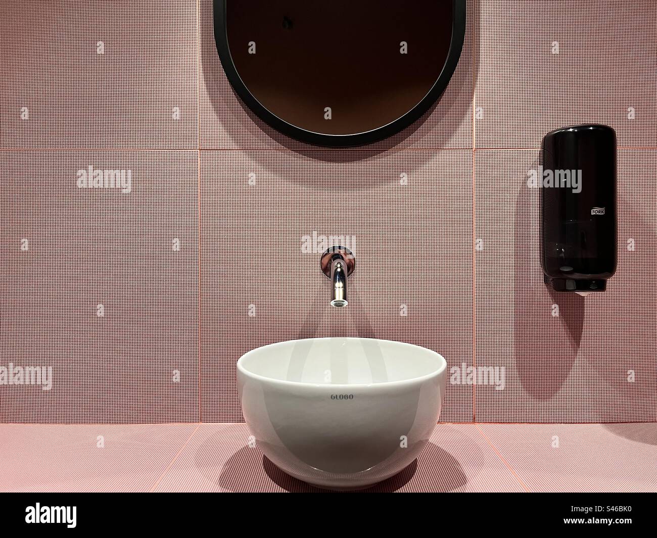 Pink interior modern design sink in public bathroom Stock Photo - Alamy