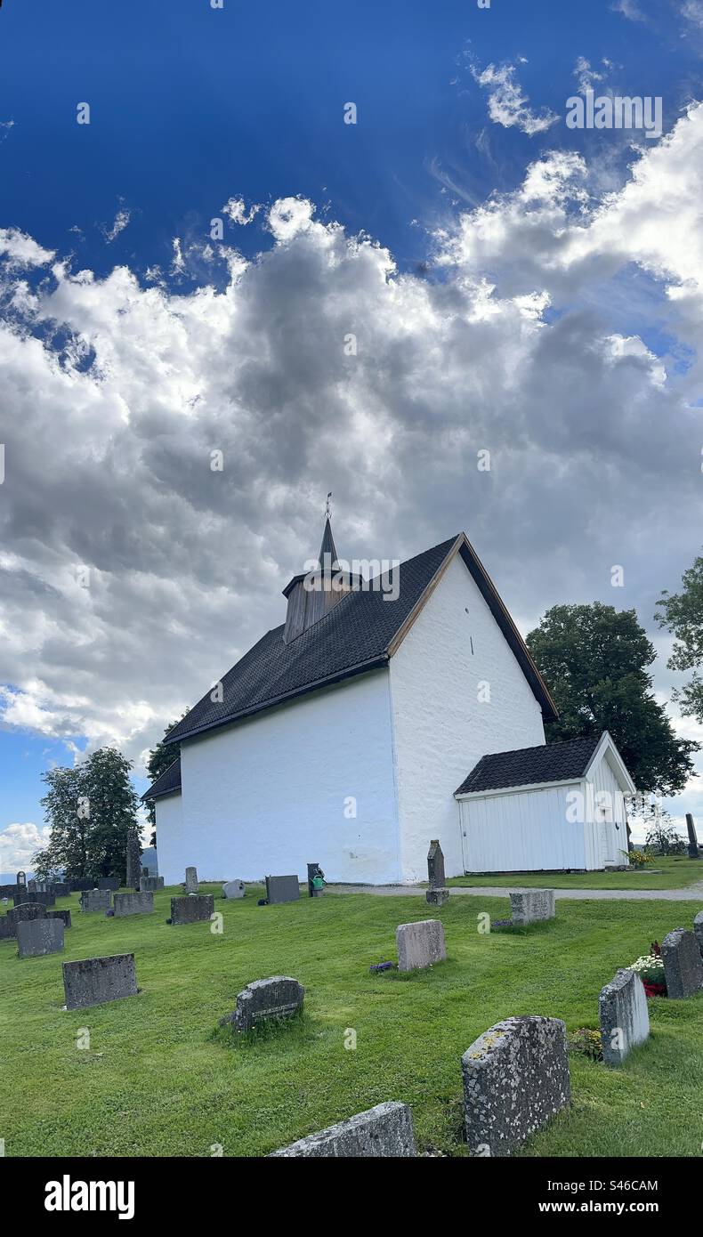 The white, stone church was built in a long church design around the ...