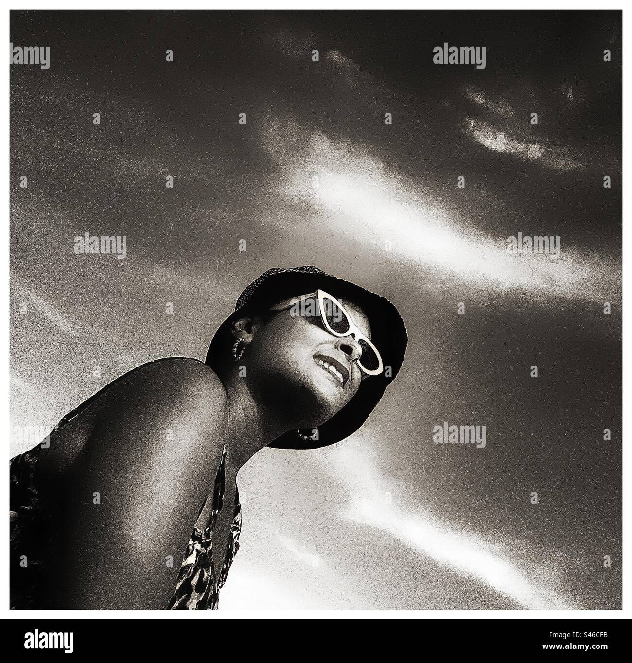 Young woman sunbathing hi-res stock photography and images - Alamy