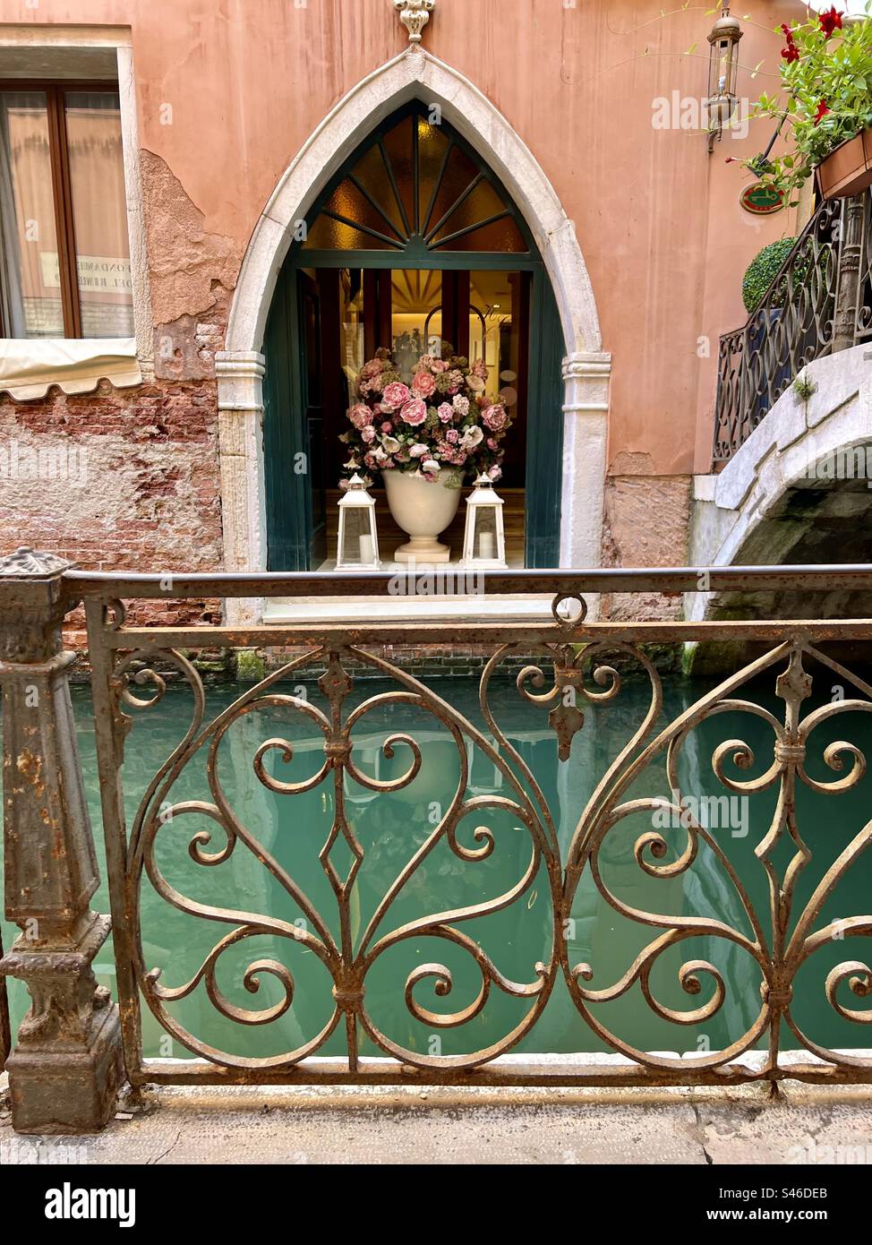 Pretty arrangement of pink flowers in a gothic style window, Rio de S ...