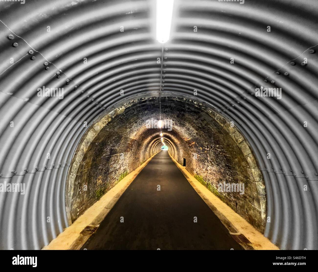 Bobbin mill tunnel on Keswick to Threlkeld path with figures ...