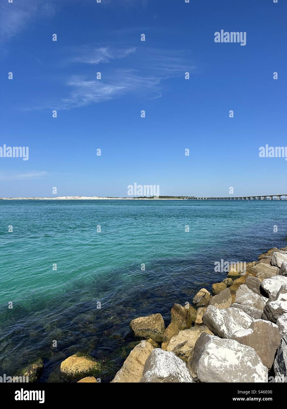 Gulf of Mexico water and rocky jetties Norriego Point Destin, Florida ...