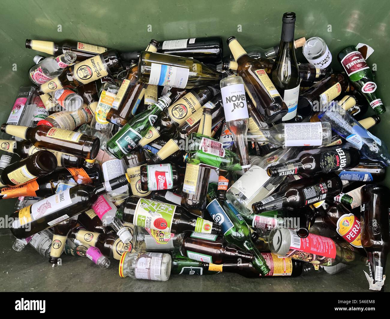Bottles in collection bin from above Stock Photo - Alamy
