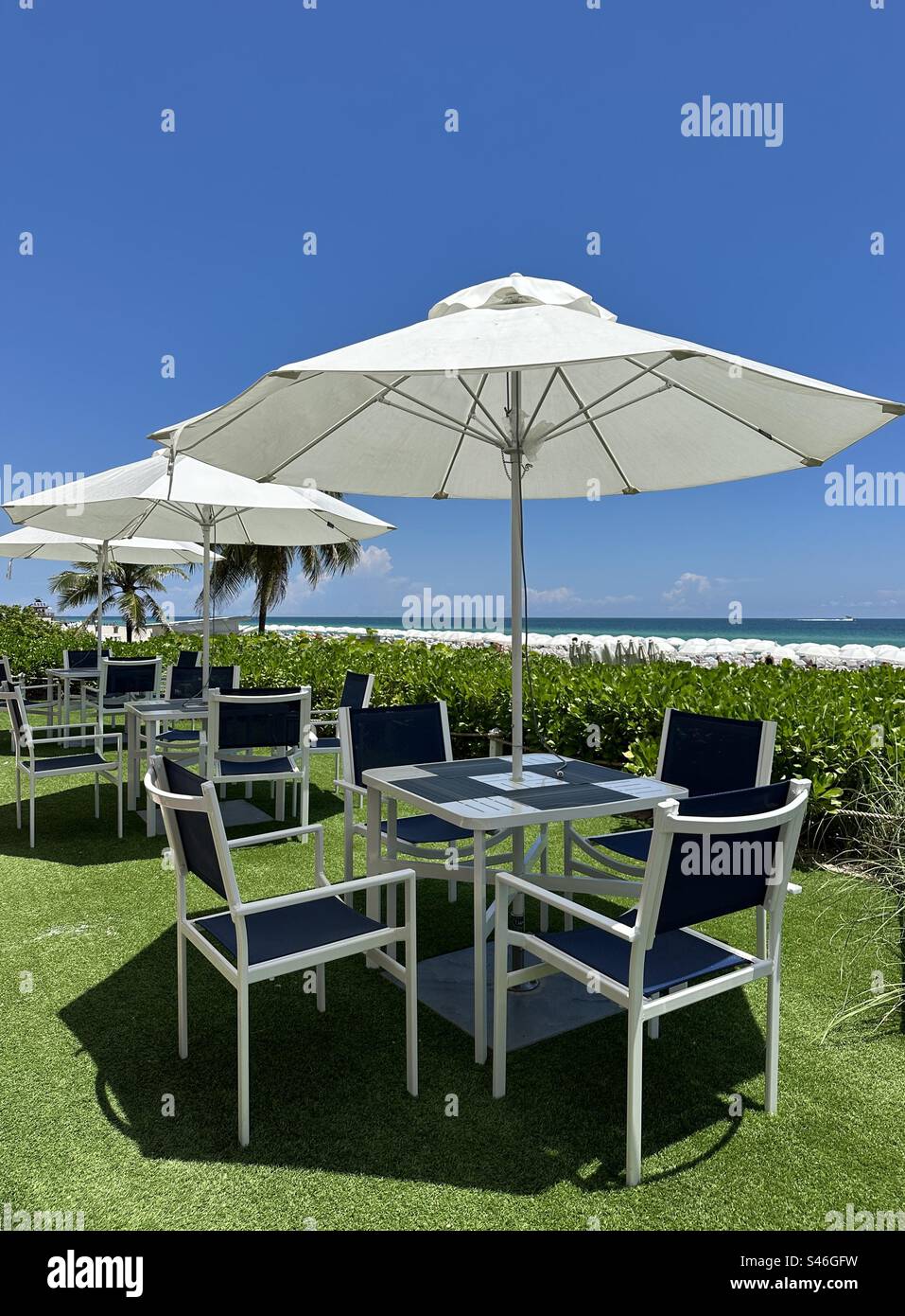 Outdoor dining area with beach view Stock Photo - Alamy