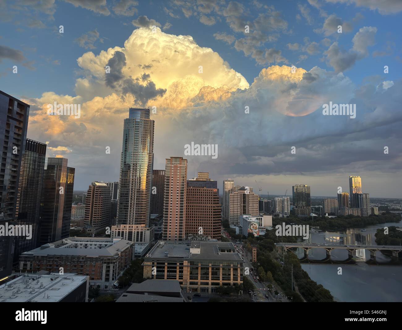 Cumulus clouds over Austin, Texas skyline at sunset with Ladybird Lake ...