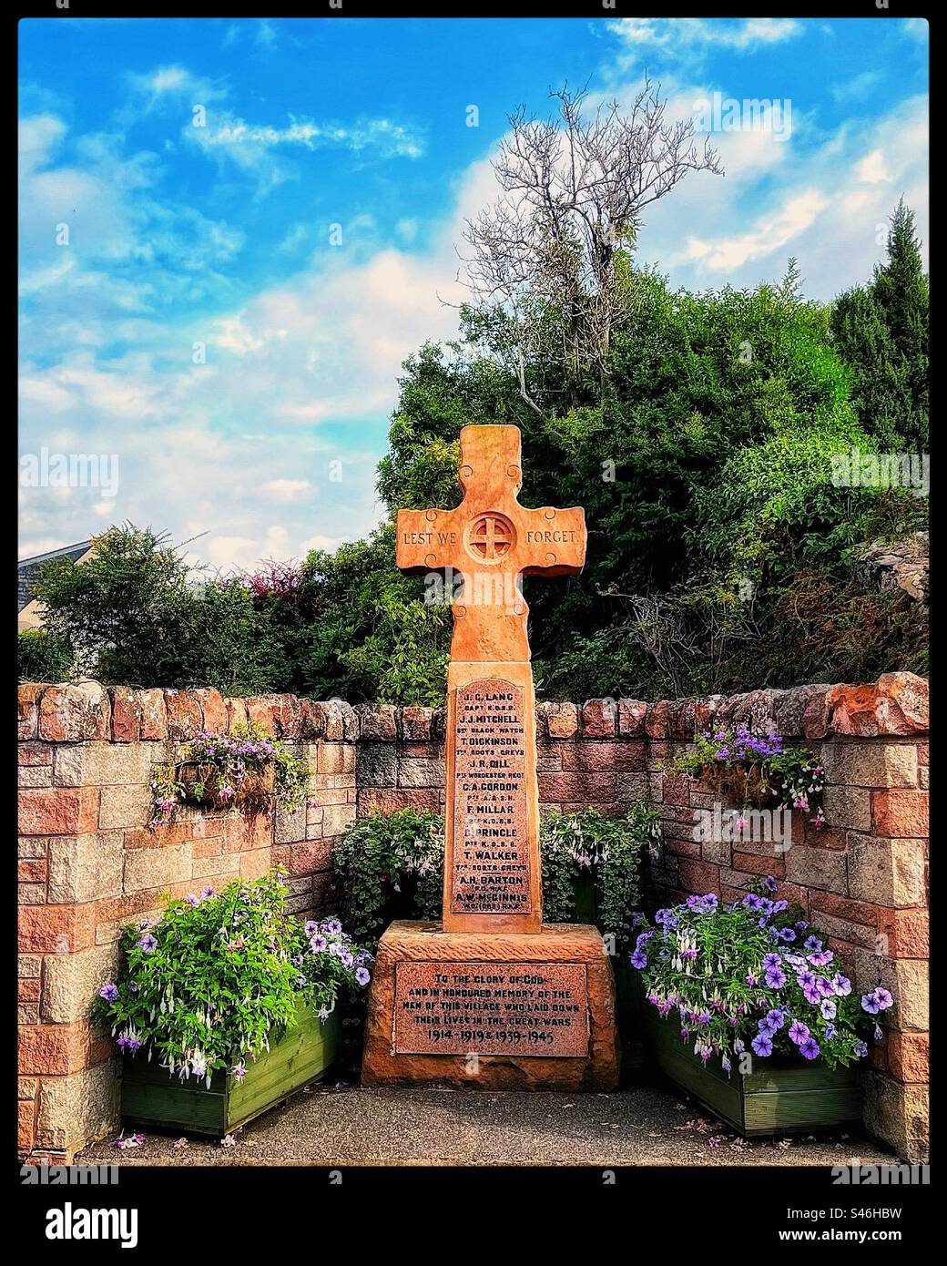 Village war memorial with flowers Stock Photo - Alamy
