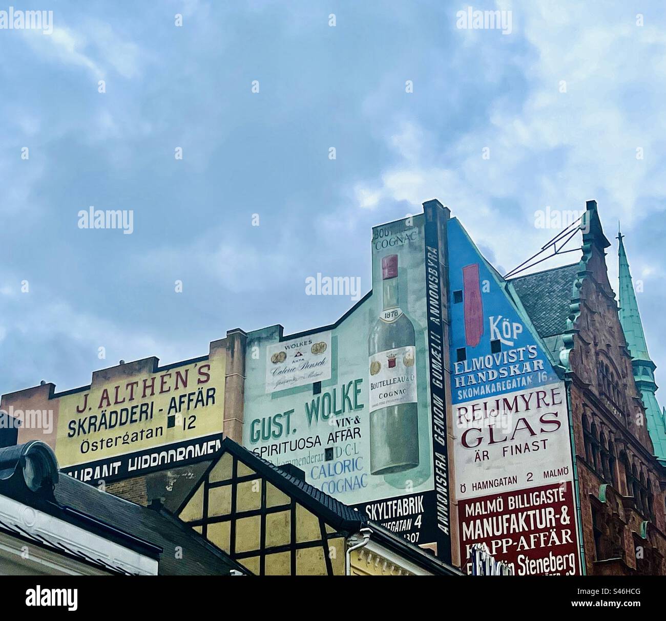 Old style advertisements painted on the walls of old buildings in Malmö ...