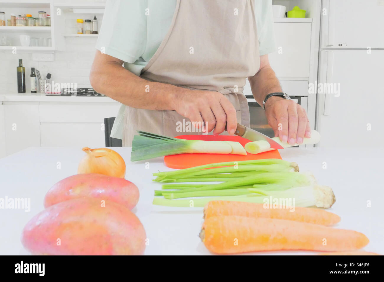 Man cooking vegetables hi-res stock photography and images - Alamy
