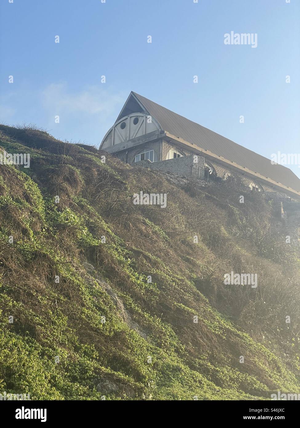 House on top of a hill/mountain with a beautiful blue sky on top Stock ...