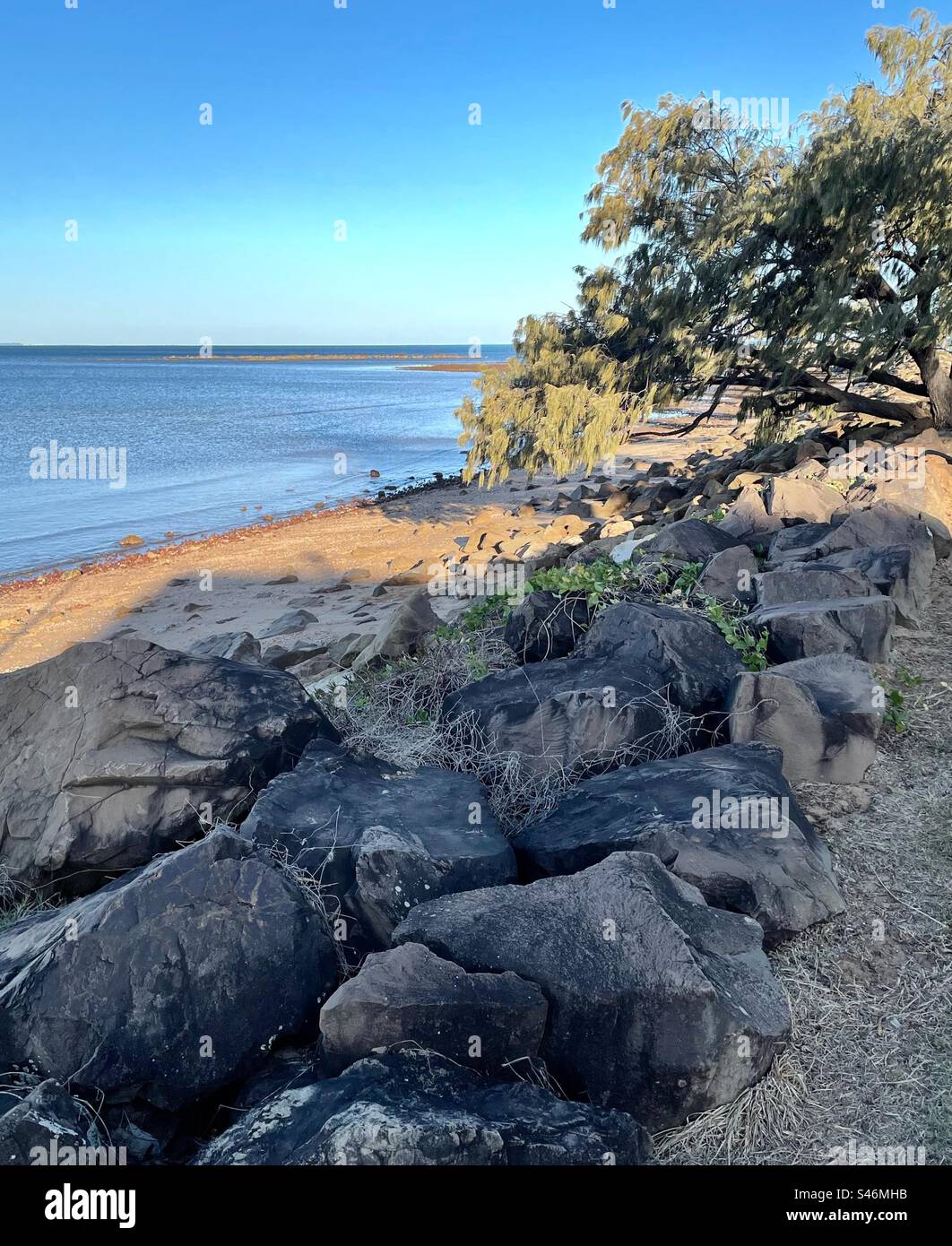 Boulders line the beach to prevent erosion Stock Photo - Alamy