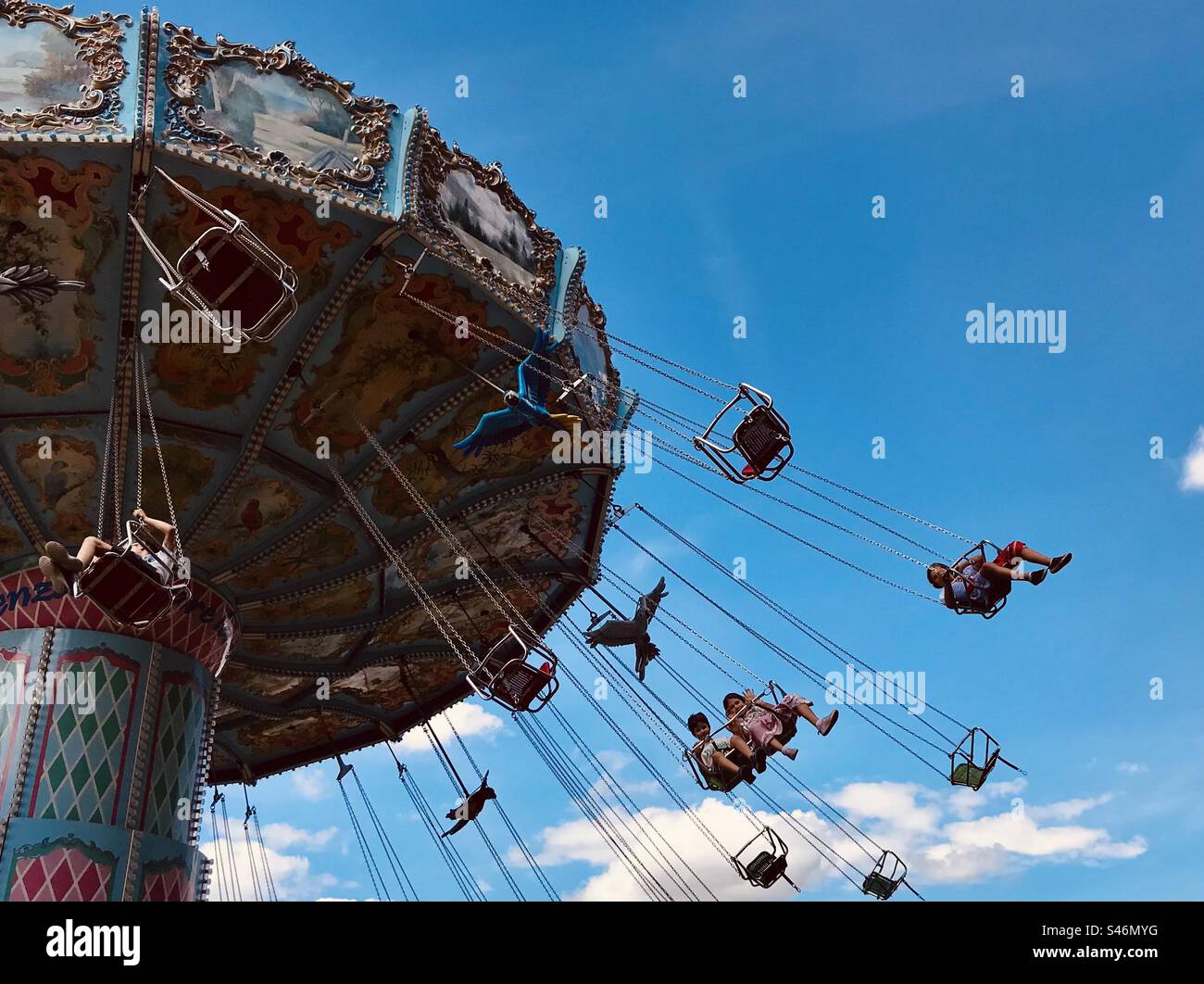 Kids riding a Carousel Stock Photo - Alamy