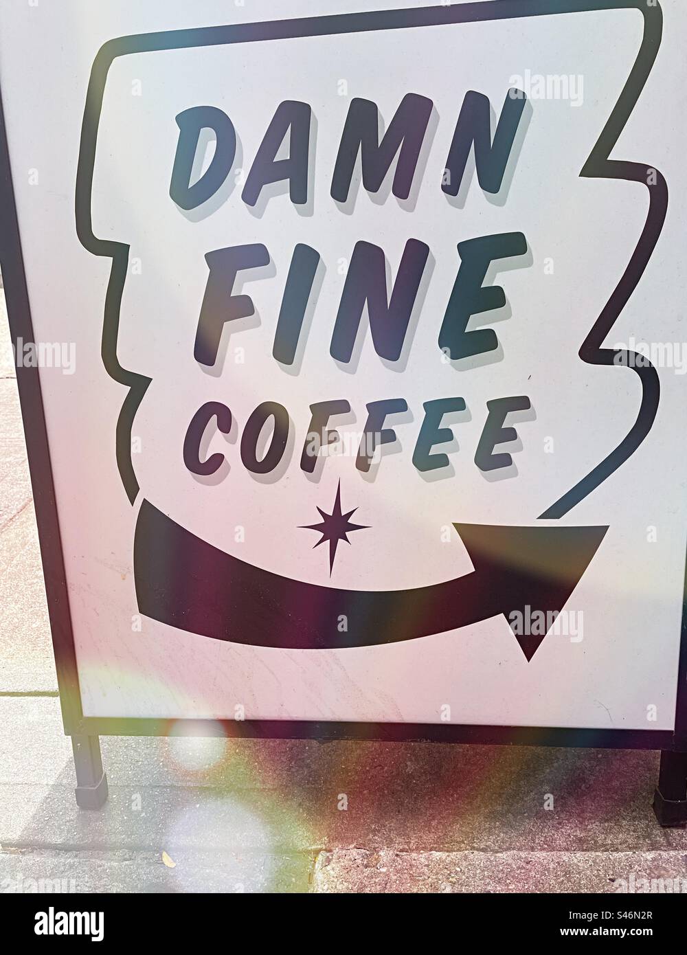 Sidewalk sandwich board” damn fine coffee” in front of a New York City ...