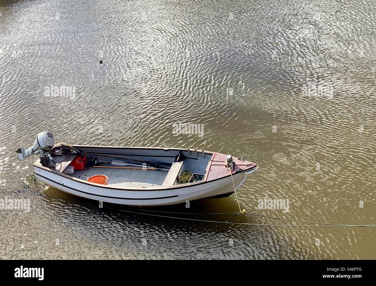 Small boat tied up to it hi-res stock photography and images - Alamy