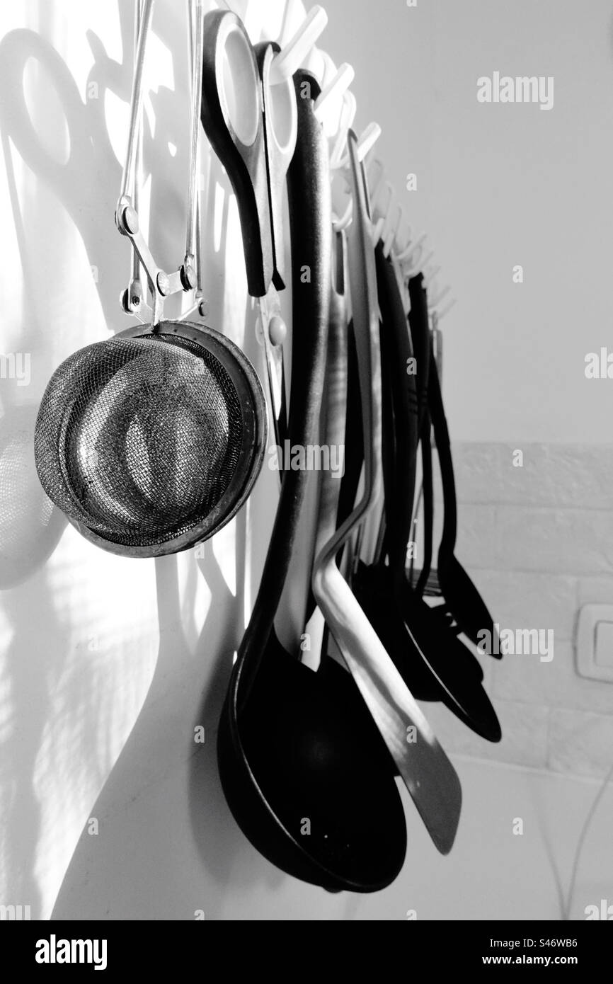 Kitchen utensils hanging in kitchen hi-res stock photography and images ...