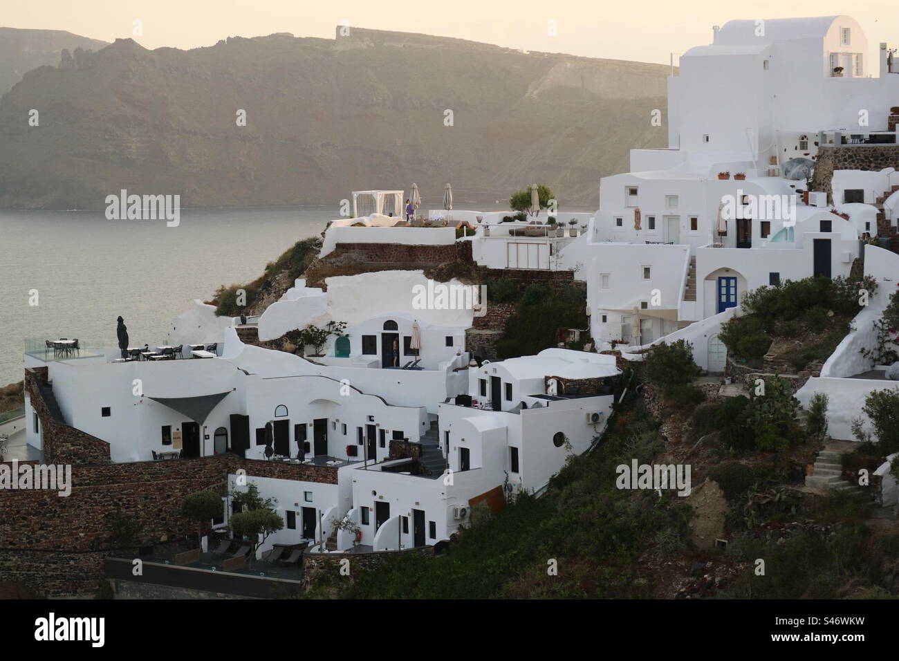 White buildings overlooking the Mediterranean, volcano of Santorini ...