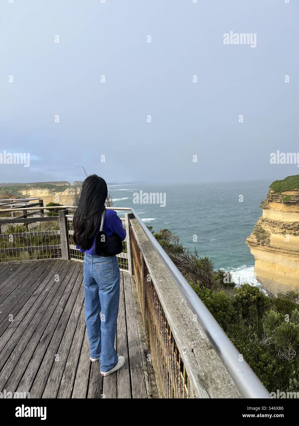 Asian girl with long back hair viewing the twelve apostle at the Great ...