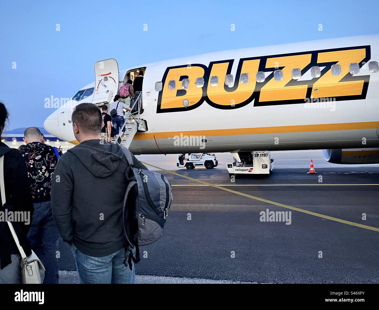 Passengers ready to embark a Ryanair jet plane operated by Buzz in the Sofia Airport, Sofia ...