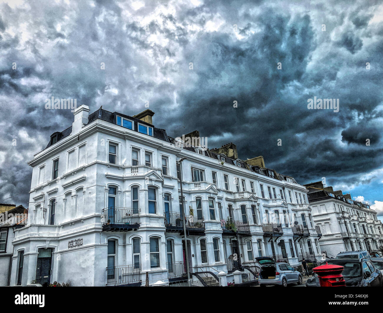 Victorian Seafront Houses with a louring grey sky above Stock Photo - Alamy