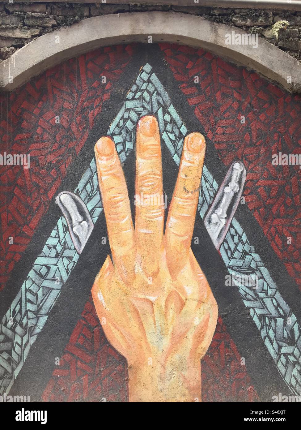 Mural with a hand holding up three fingers in Kathmandu Nepal Stock ...