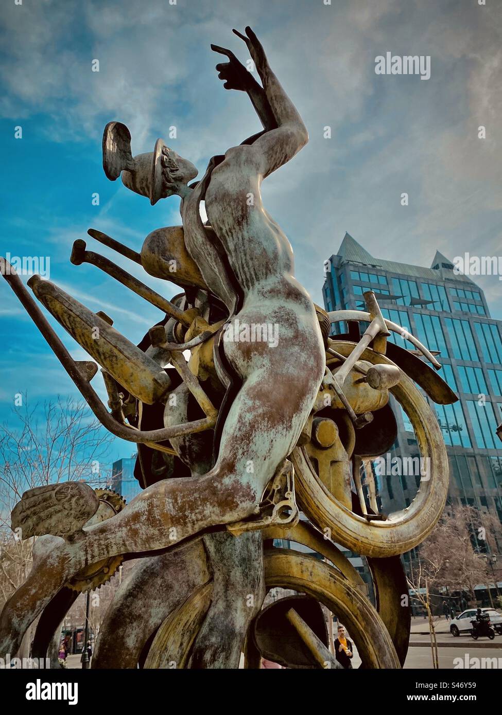 A moment of pure joy and freedom captured in bronze, as figures dance ...