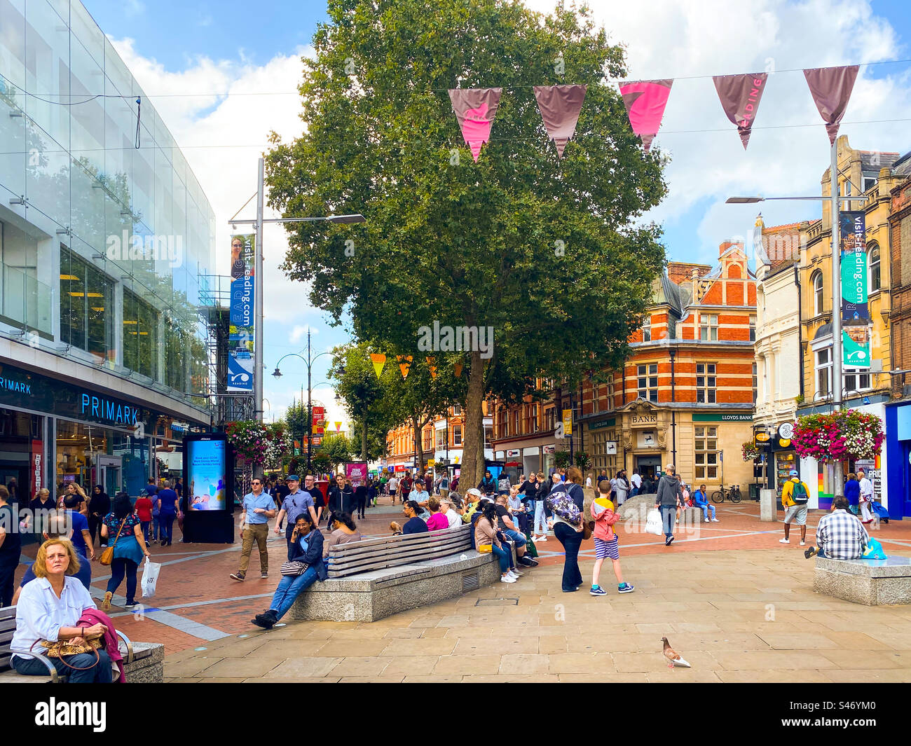Broad street in Reading town centre is busy with people on a Saturday ...