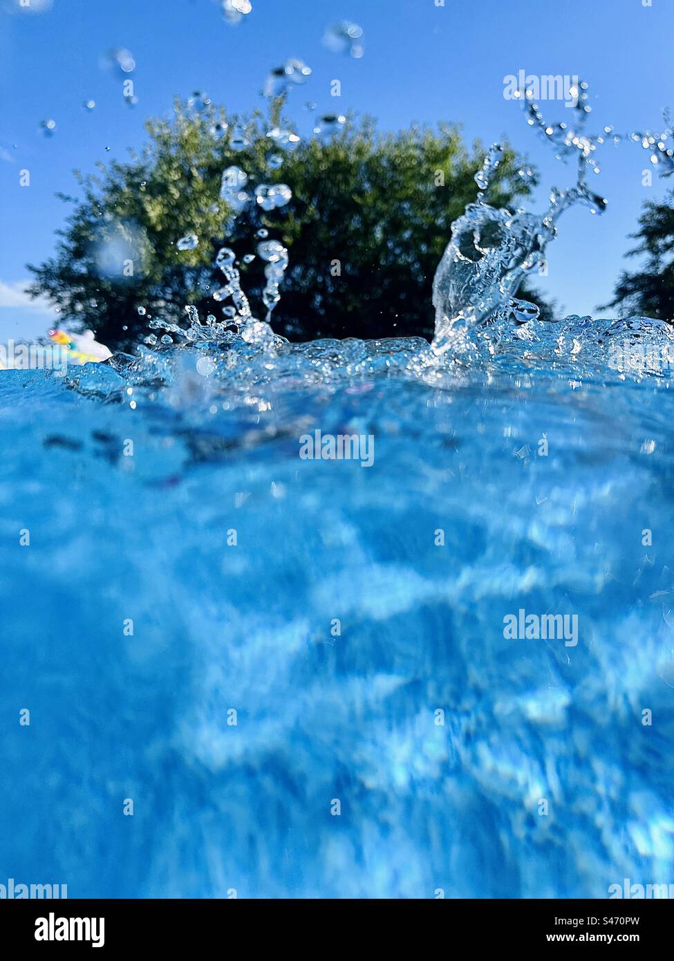 Water splash in a swimming pool Stock Photo - Alamy