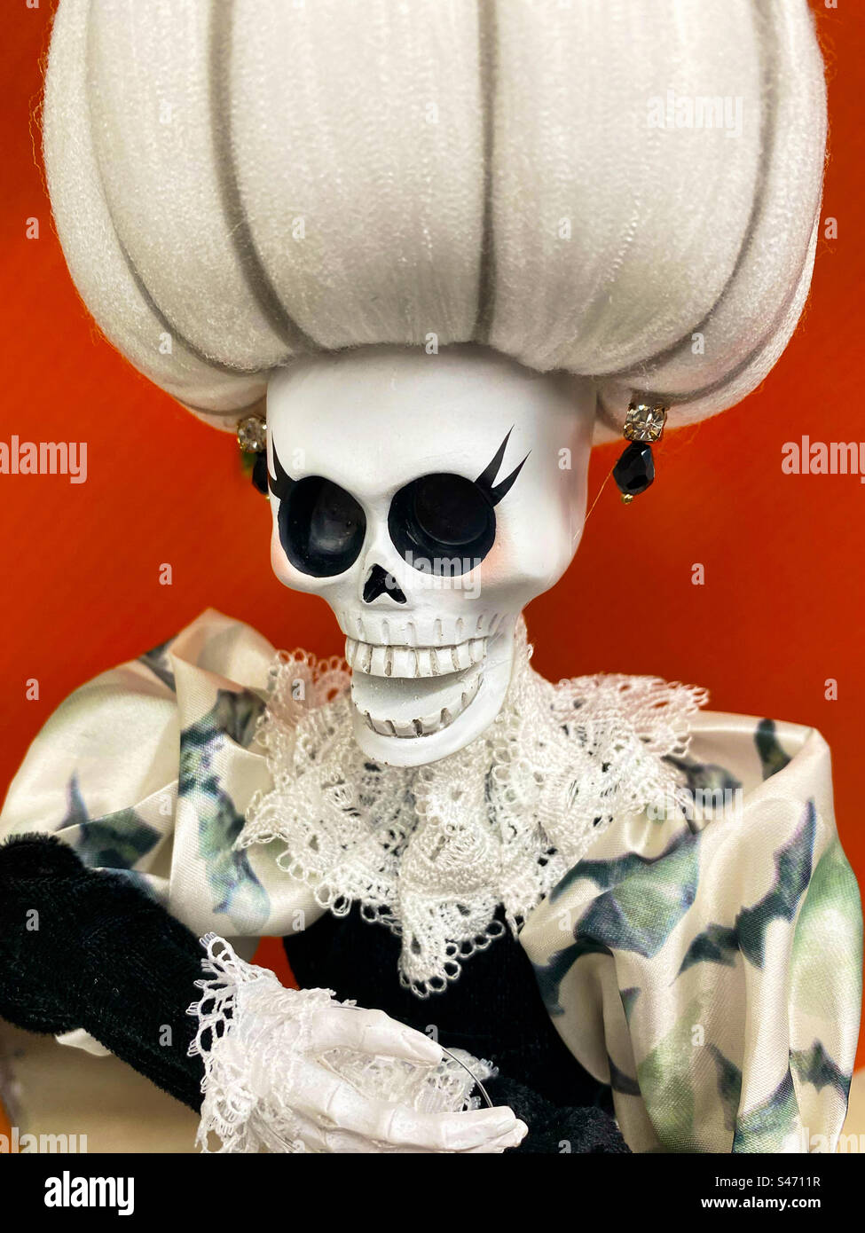 Halloween decor - skeleton with big hair Stock Photo - Alamy