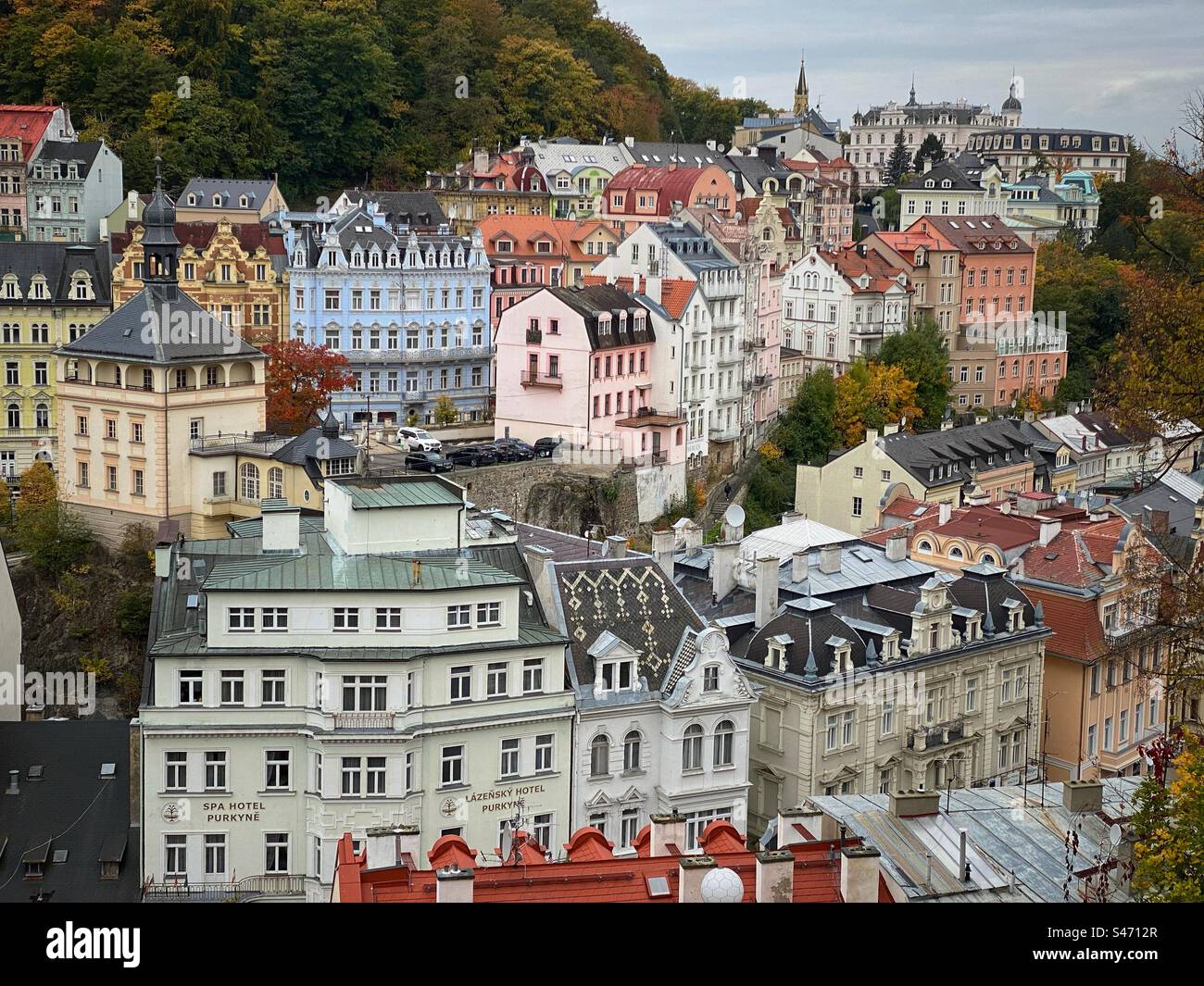 Historical colorful old buildings surrounded by autumn forests and ...