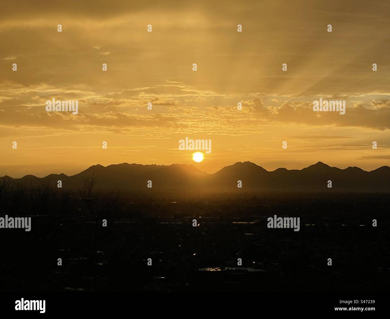 Glorious sunrise, Golden rays of sun lighting up monsoon clouds ...