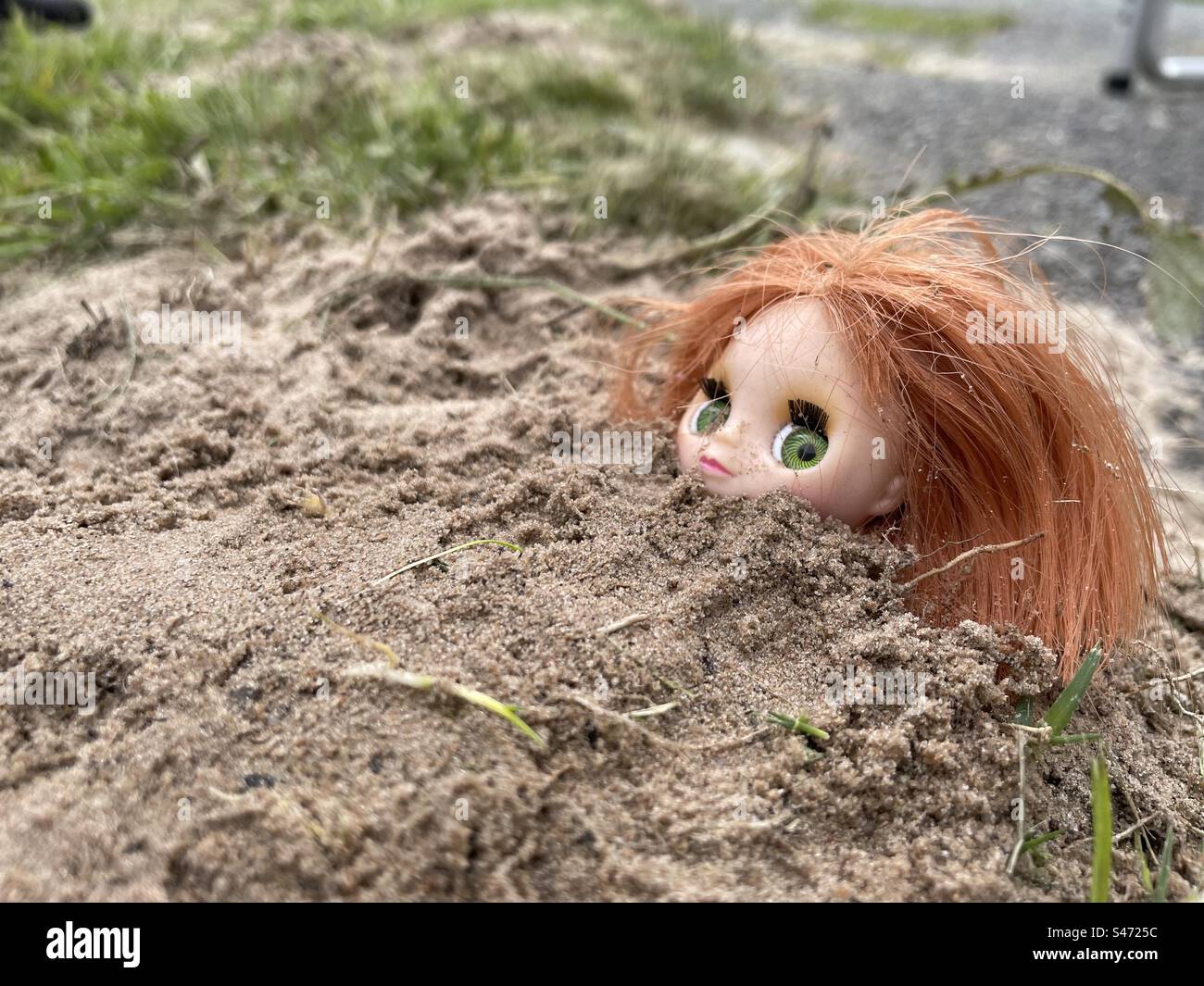 Buried in sand hi-res stock photography and images - Alamy