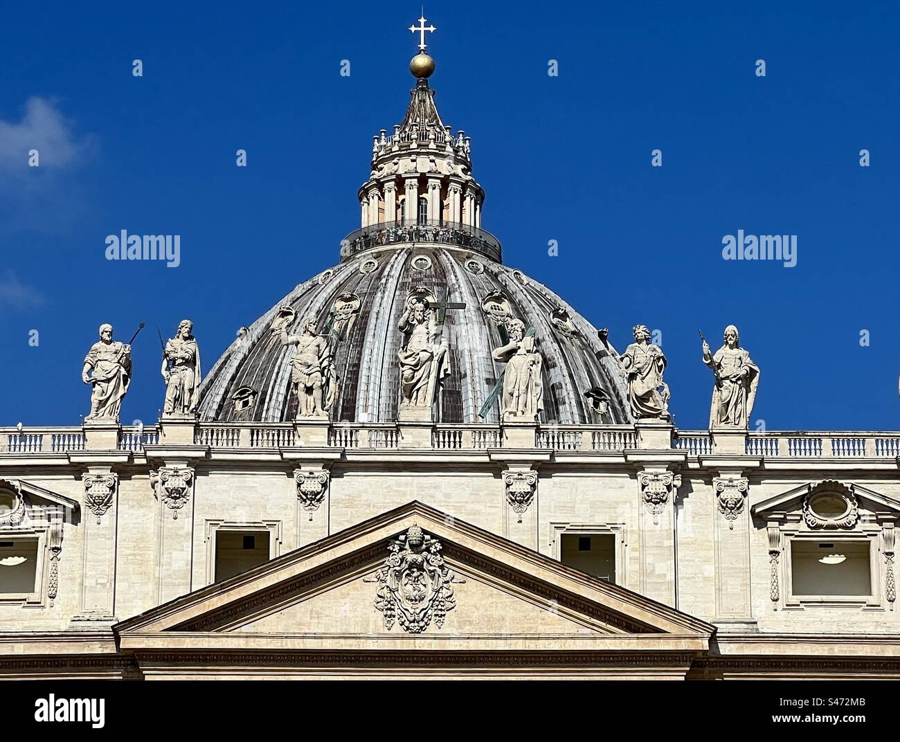 The dome and statues of Saints on the roof of Saint Peter’s Basilica ...