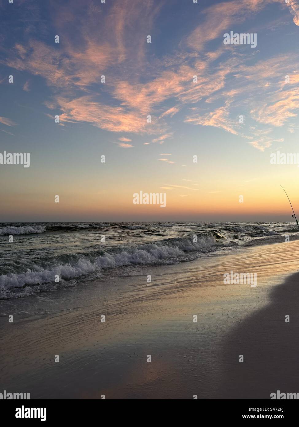 Soft colorful sunset skies with sand reflections over the Gulf of ...