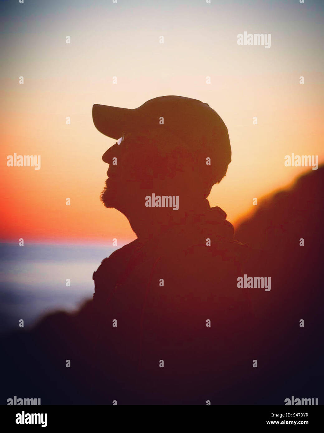 With hat profile backlight photo hi-res stock photography and images ...