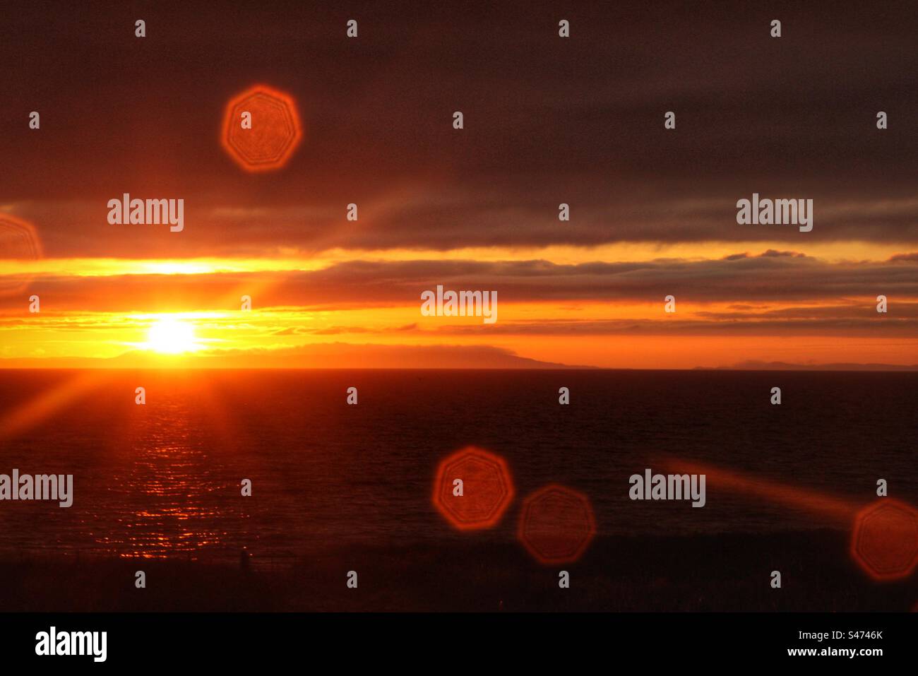 Sunset with light rain falling on the lens Stock Photo - Alamy