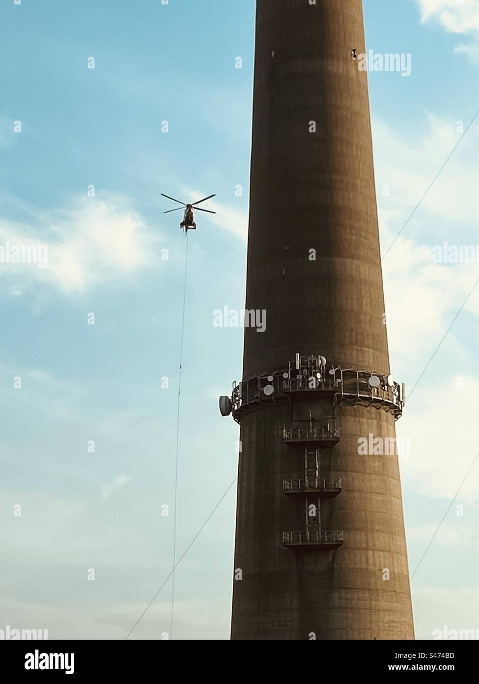 Helicopter working on emly moor mast in Yorkshire Stock Photo - Alamy