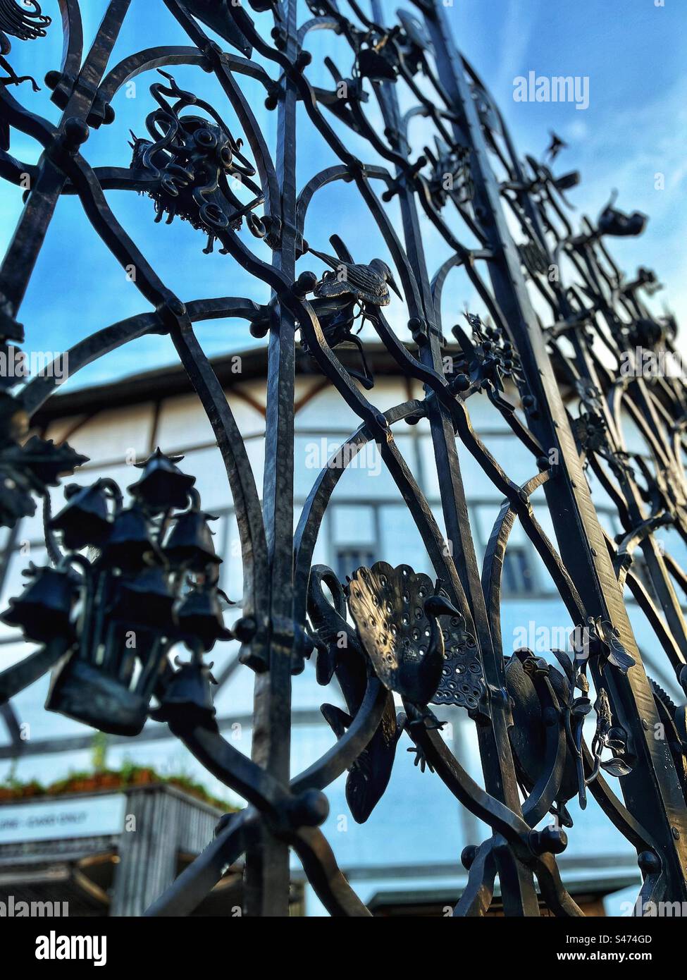 The Globe Theatre in London seen through the ornate gates. The theatre ...