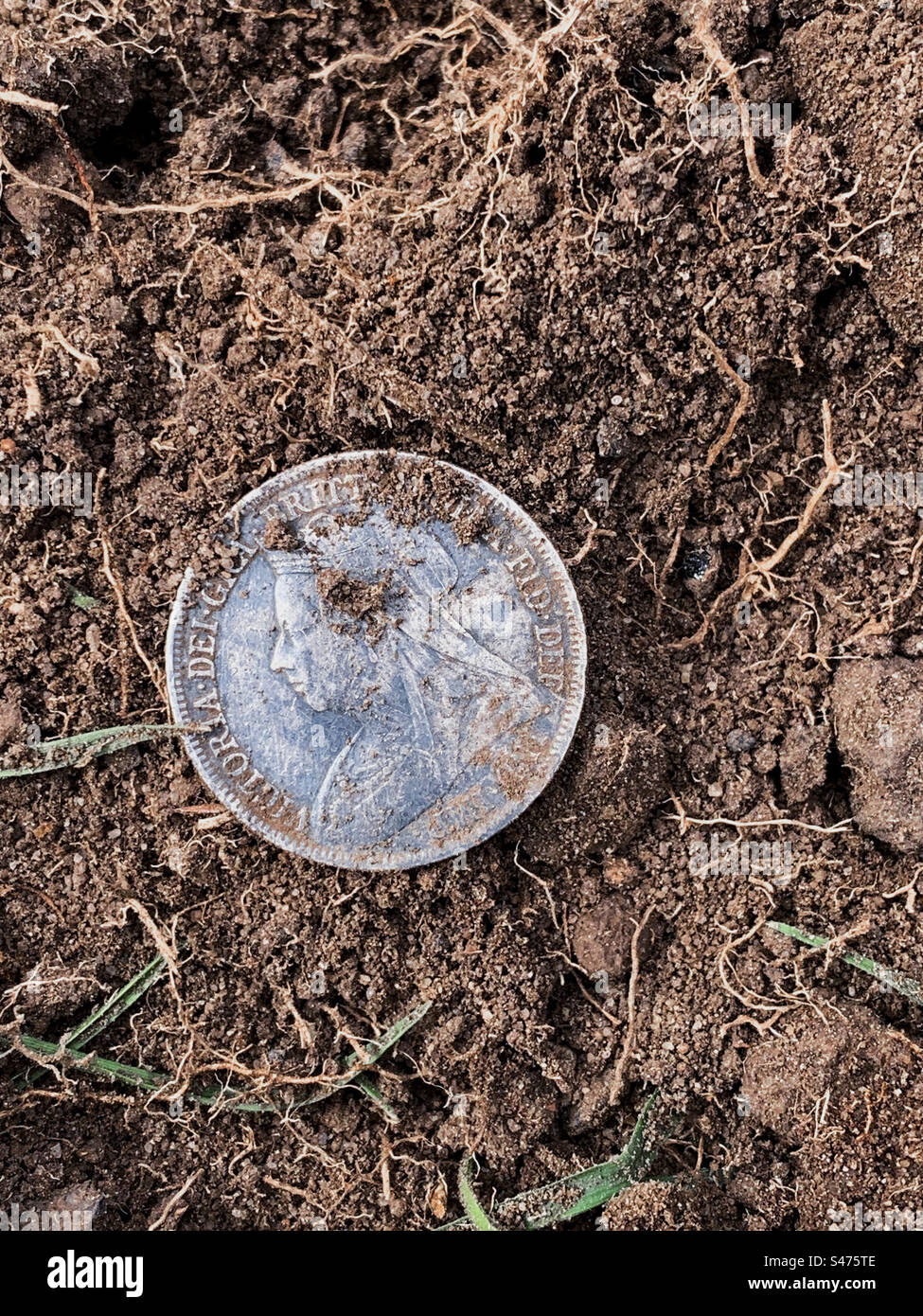 Victorian Shilling Silver Coin in Dirt Stock Photo - Alamy