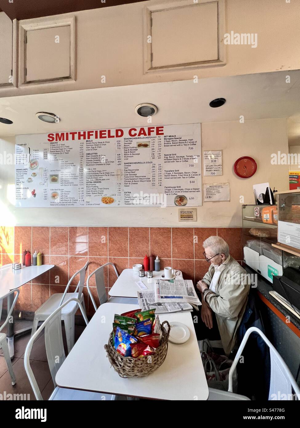 Man reading newspaper Smithfield Cafe London Stock Photo - Alamy