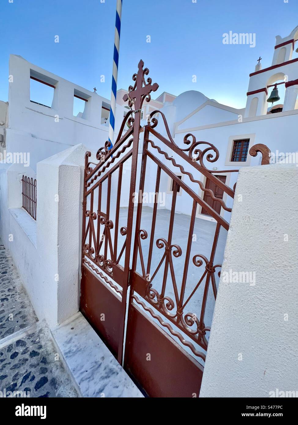 Iron gate at the entry to a church in Santorini, Greece Stock Photo - Alamy