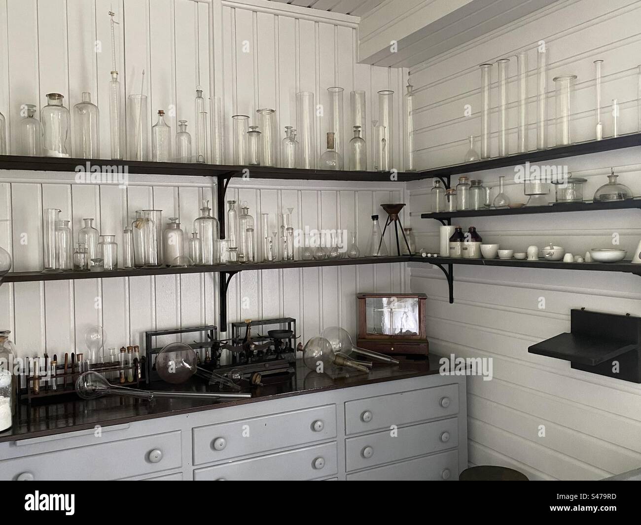 All kinds of glass is in a old time lab Stock Photo - Alamy