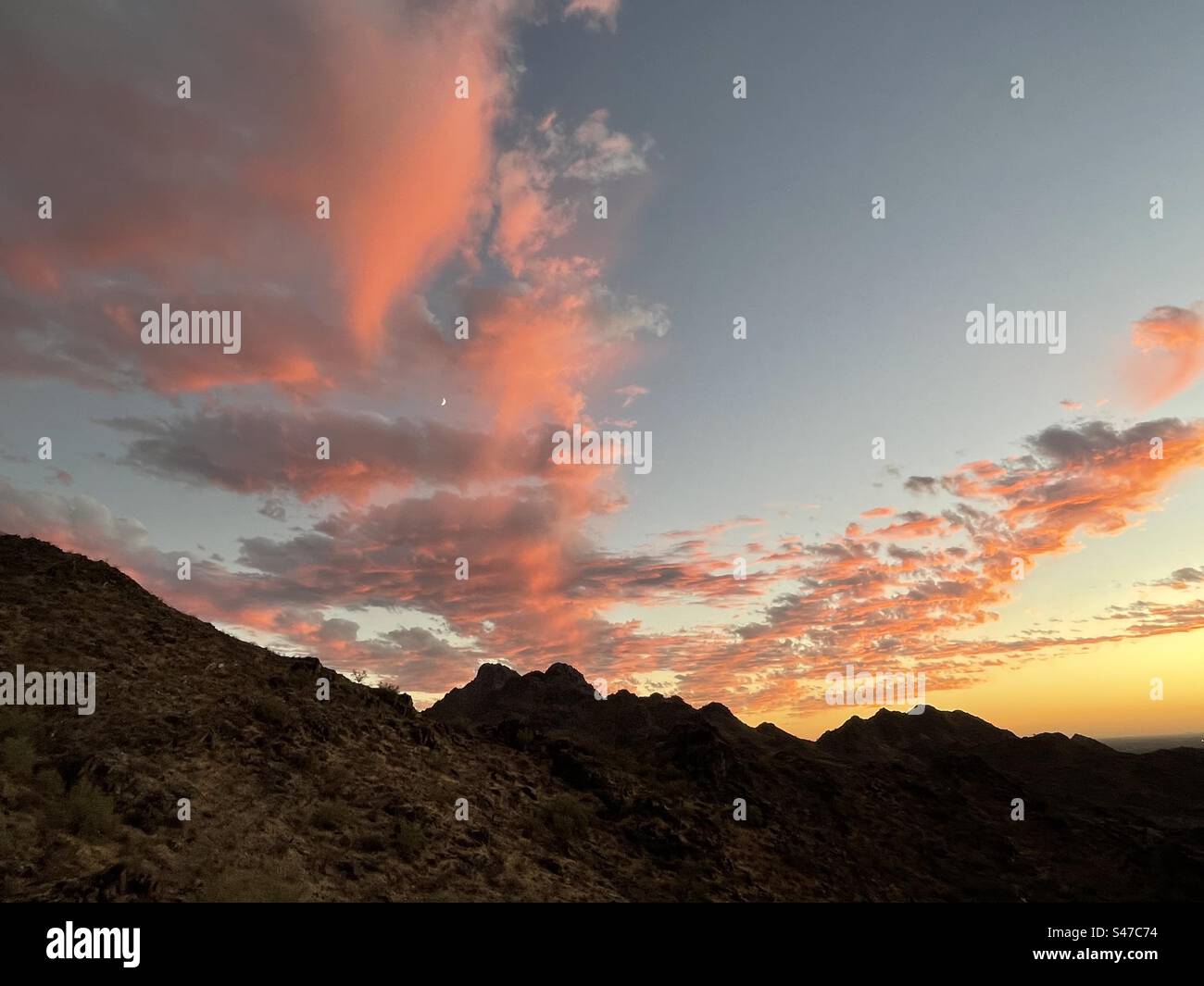 Arizona sunset, Fan of Orange and Salmon colored clouds point to ...