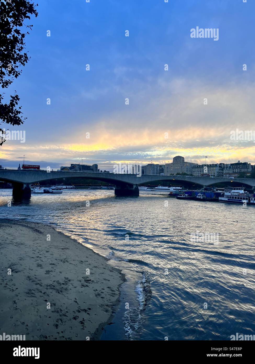 Waterloo Bridge at sunset with beach in foreground, south bank of River ...
