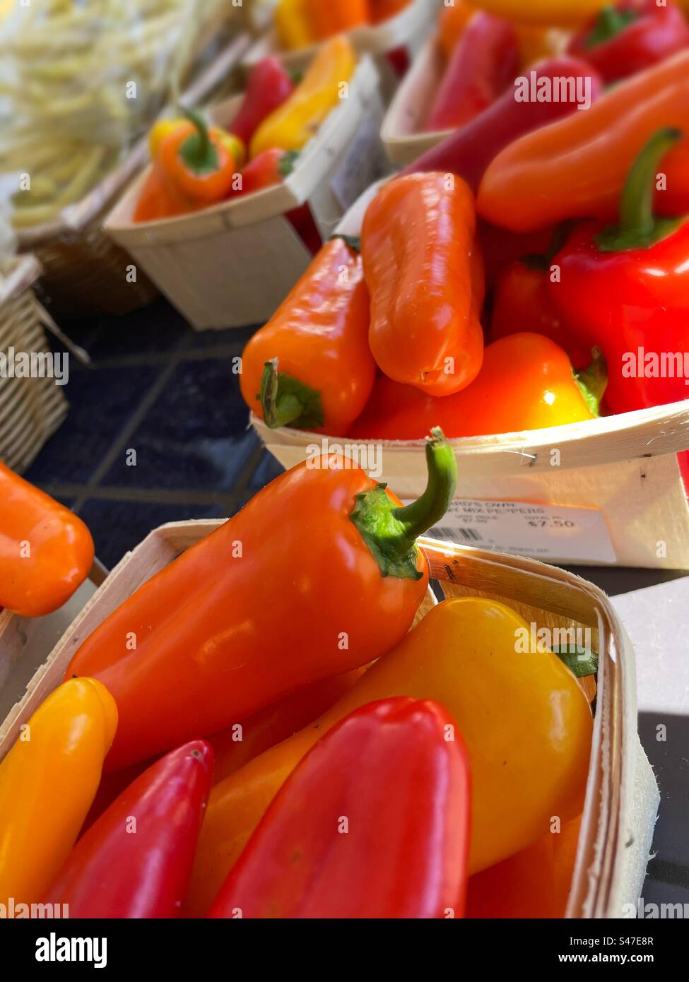 Baskets of mini peppers for sale at a farmers produce stand in New ...