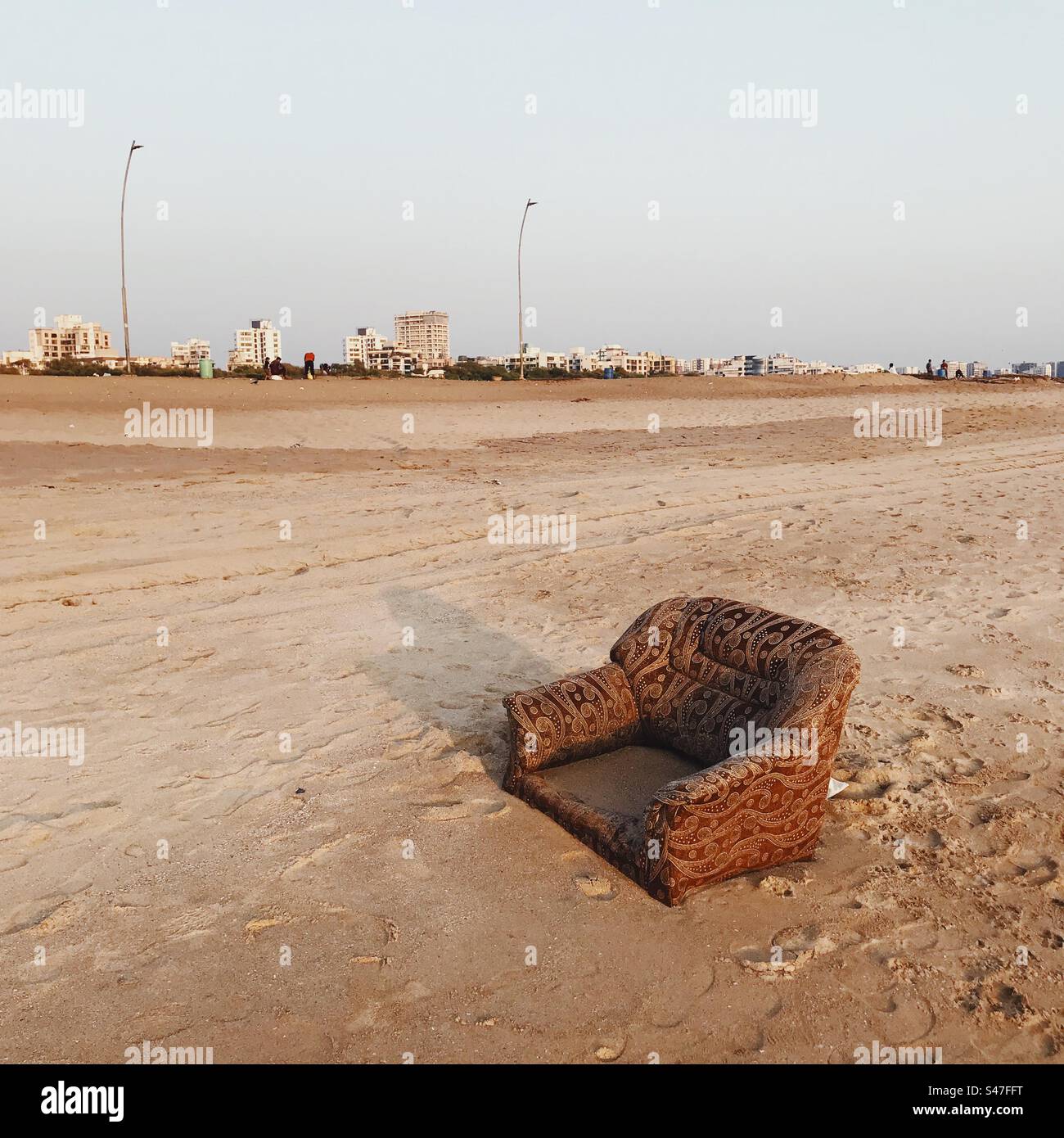 A sofa lying on a beach Stock Photo - Alamy