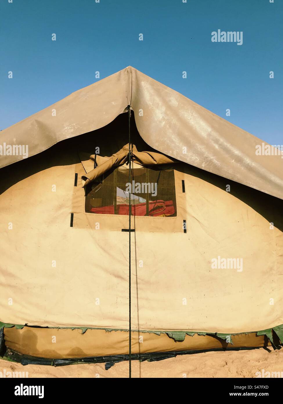 Exteriors of a brown tent with a window Stock Photo - Alamy
