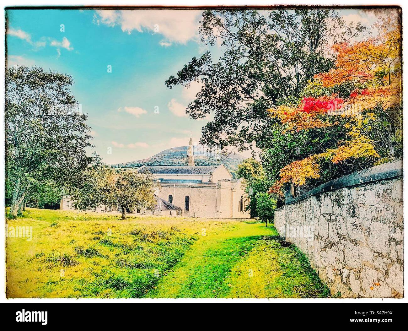 Melrose parish church with the Eildons in the background in autumn ...