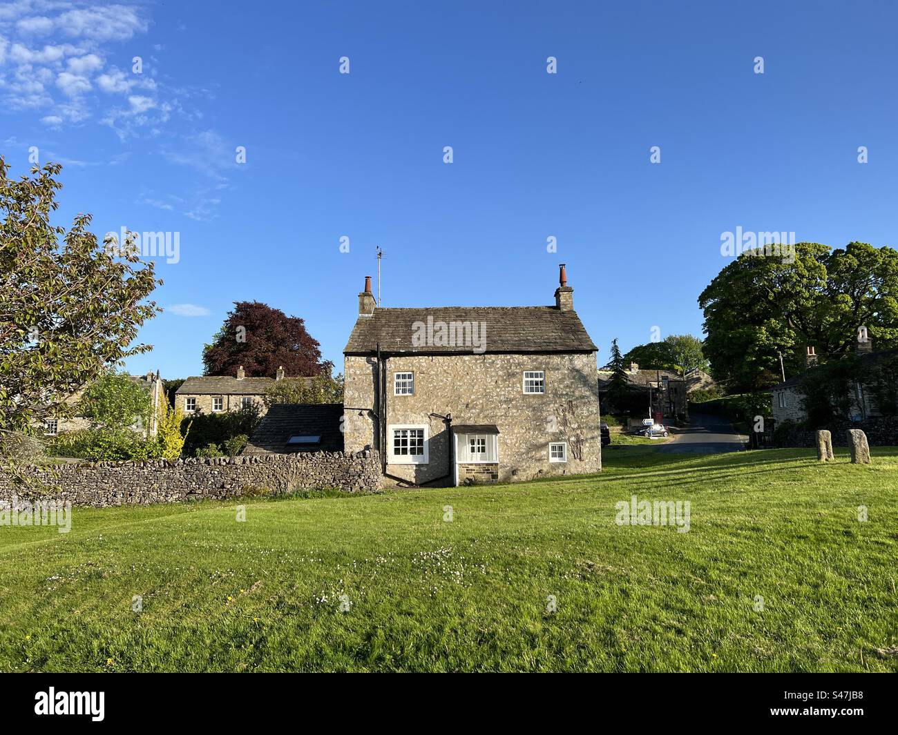 View across the green, in the Yorkshire Dales village of, Airton ...