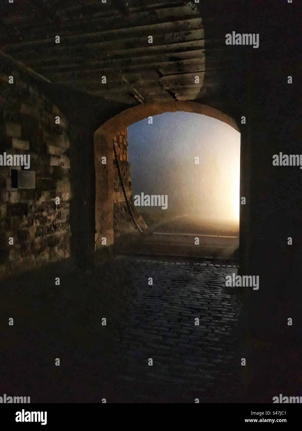 Through a draw bridge at Dover Castle in Kent, the mist descended and ...
