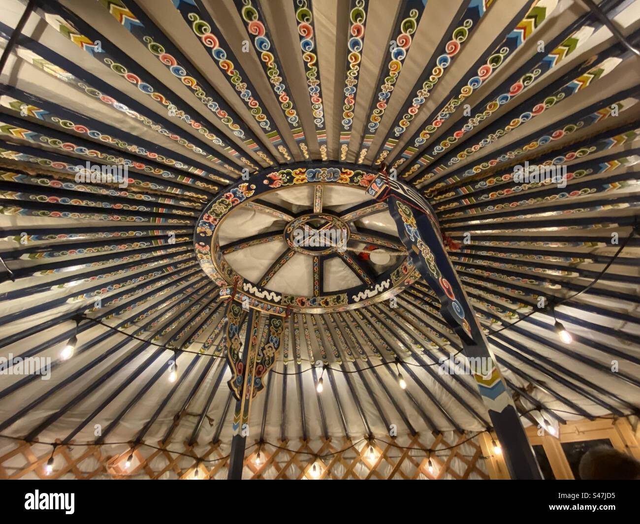 Inside a yurt,ceiling, wooden colourful with strings of lights Stock ...
